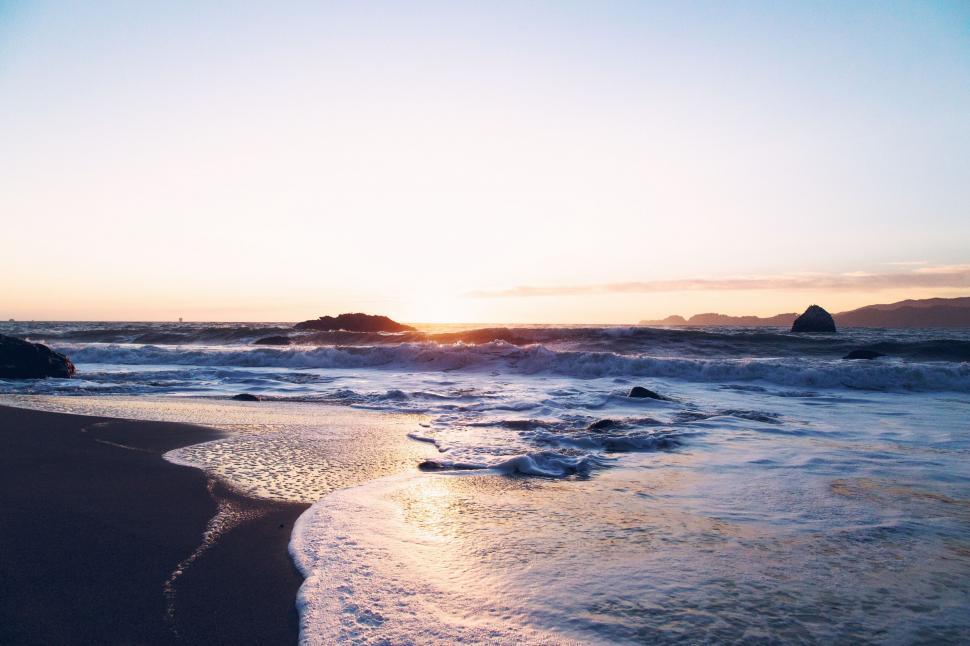 Free Stock Photo of Sun Setting Over Water at Beach | Download Free ...