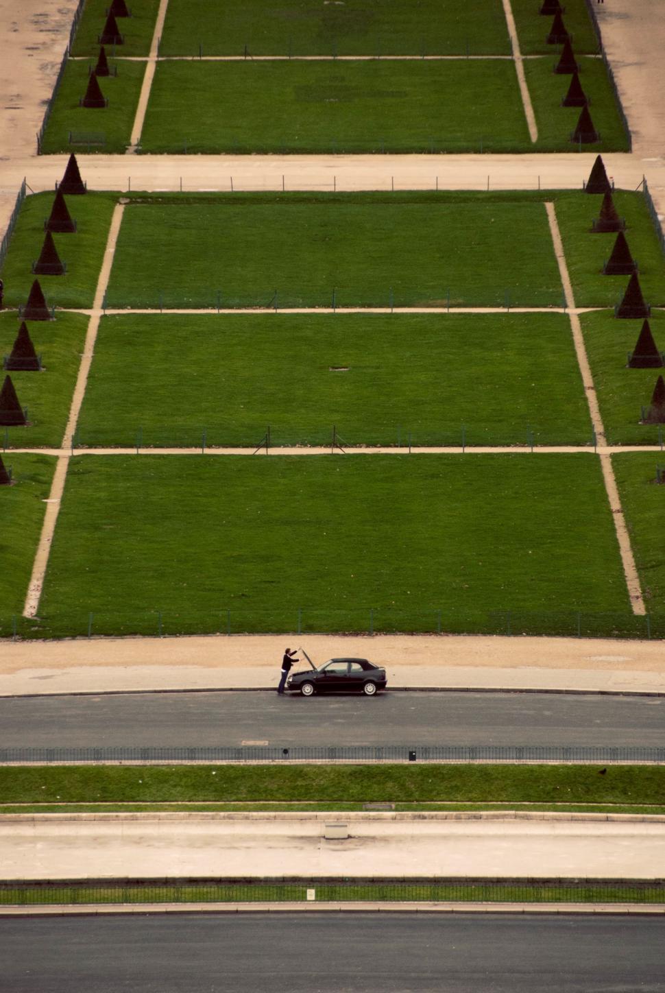 Free Stock Photo of Car Driving Down Street Next to Grass Field ...