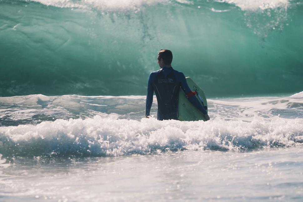 Free Stock Photo of Man Standing in Ocean With Surfboard | Download ...