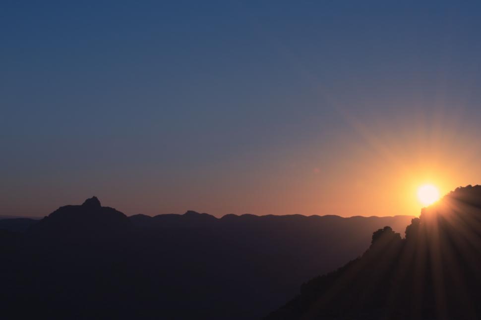 Free Stock Photo of Sun Setting Over Mountain Range | Download Free ...