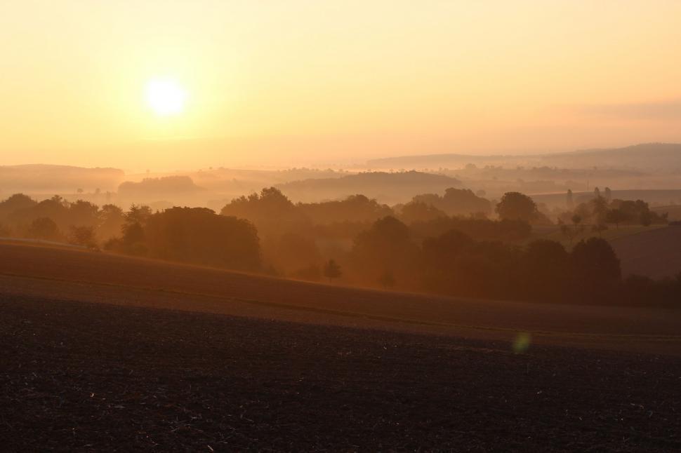Free Stock Photo of Sun Setting Over Field With Trees | Download Free ...
