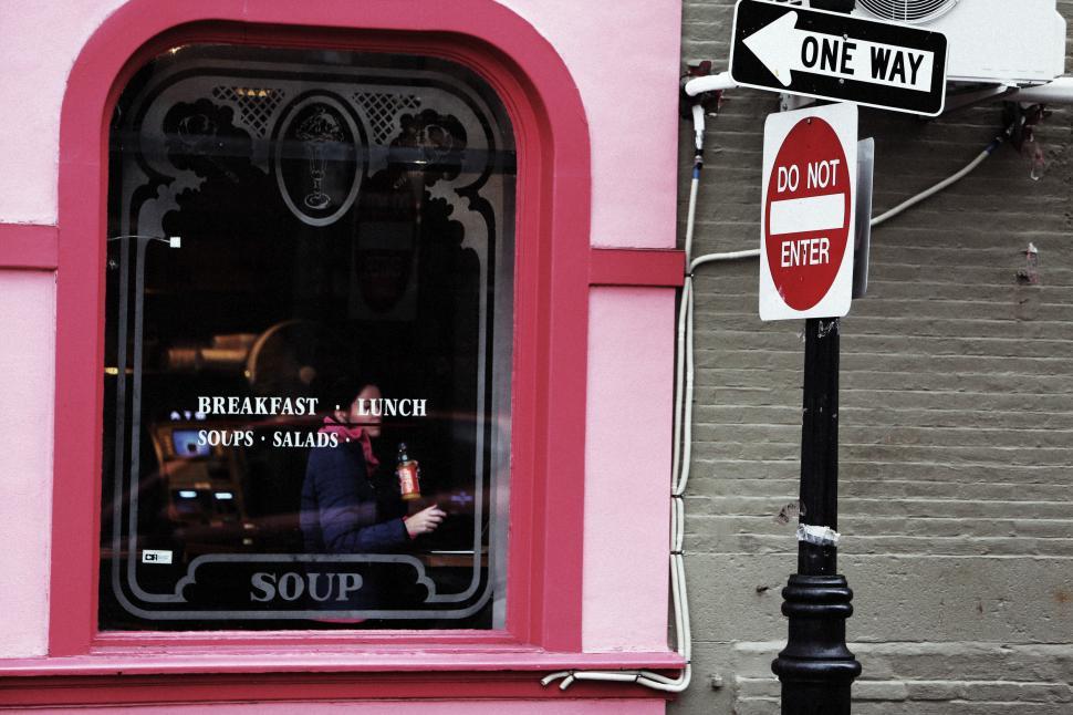Free Stock Photo of Pink Building and Street Sign on City Street ...