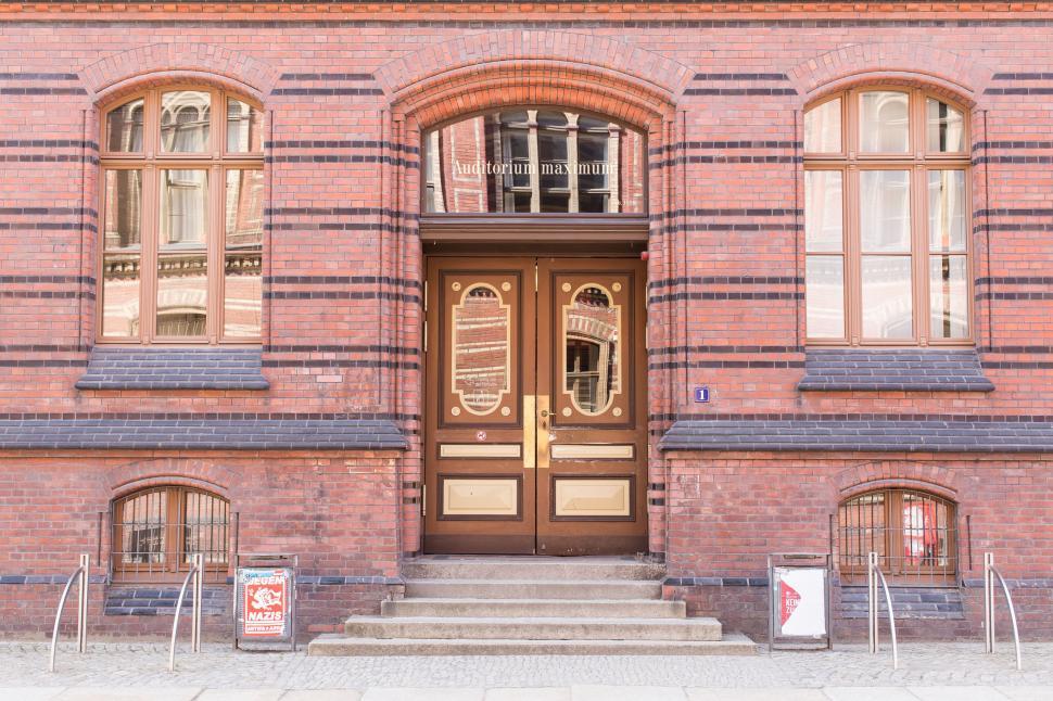Free Stock Photo of Large Brick Building With Brown Door | Download ...