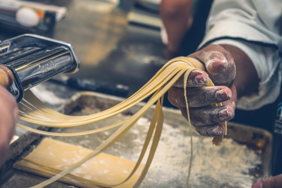 Free Stock Photo of Person Holding Gun Over Pile of Pasta | Download ...