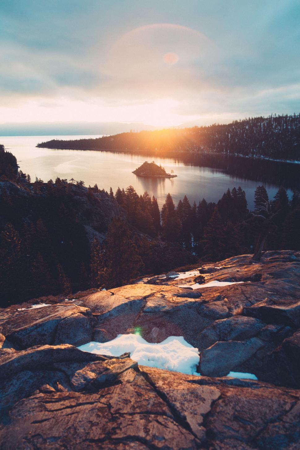 Free Stock Photo of The Sun Setting Over a Lake Surrounded by Trees ...
