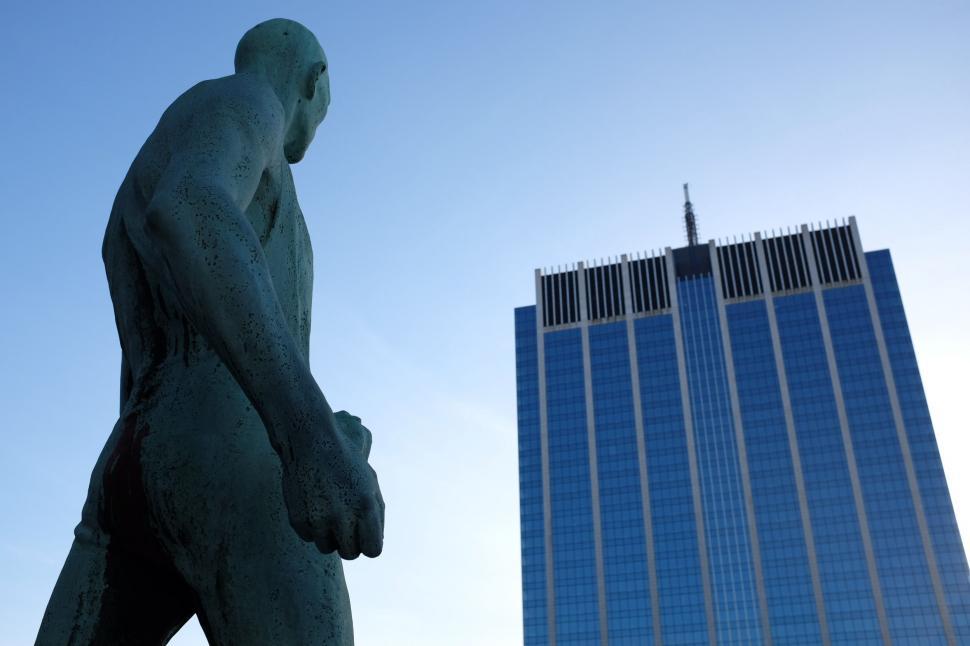 Free Stock Photo of Statue of Man in Front of Tall Building | Download ...
