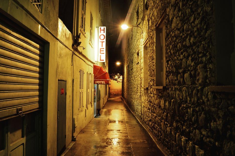 Free Stock Photo of Narrow Alley With Lit Hotel Sign at Night ...