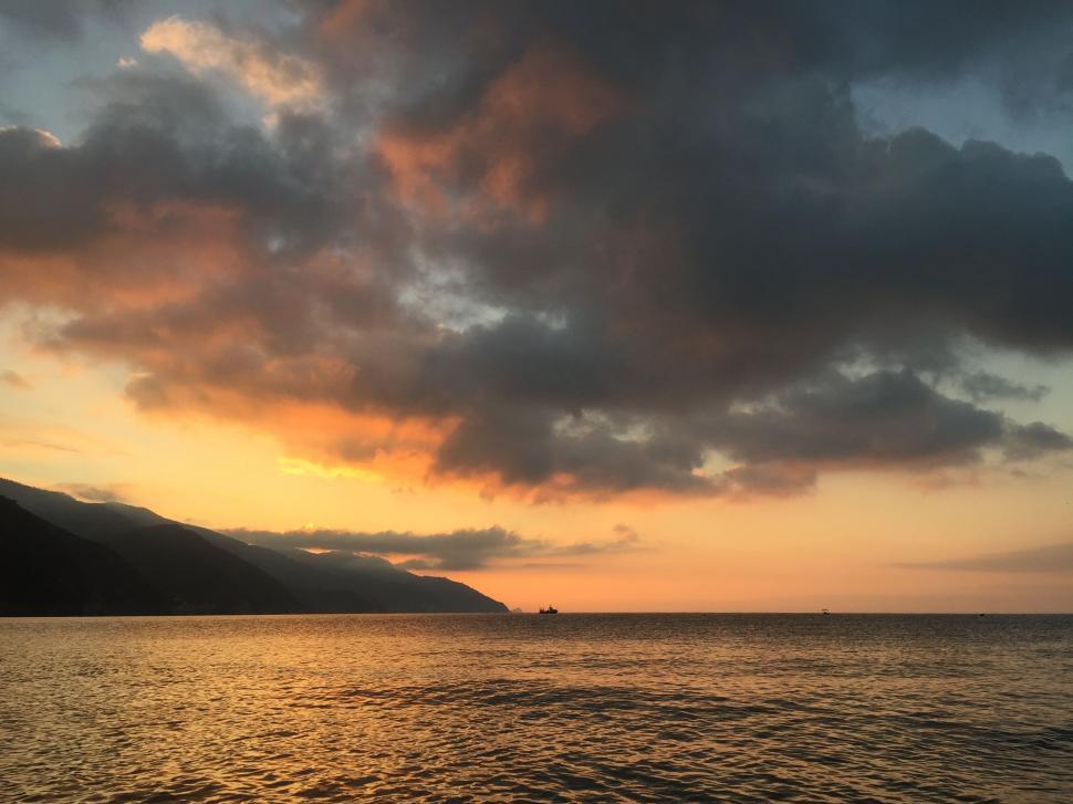 Free Stock Photo of Sun Setting Over Ocean With Boat | Download Free ...