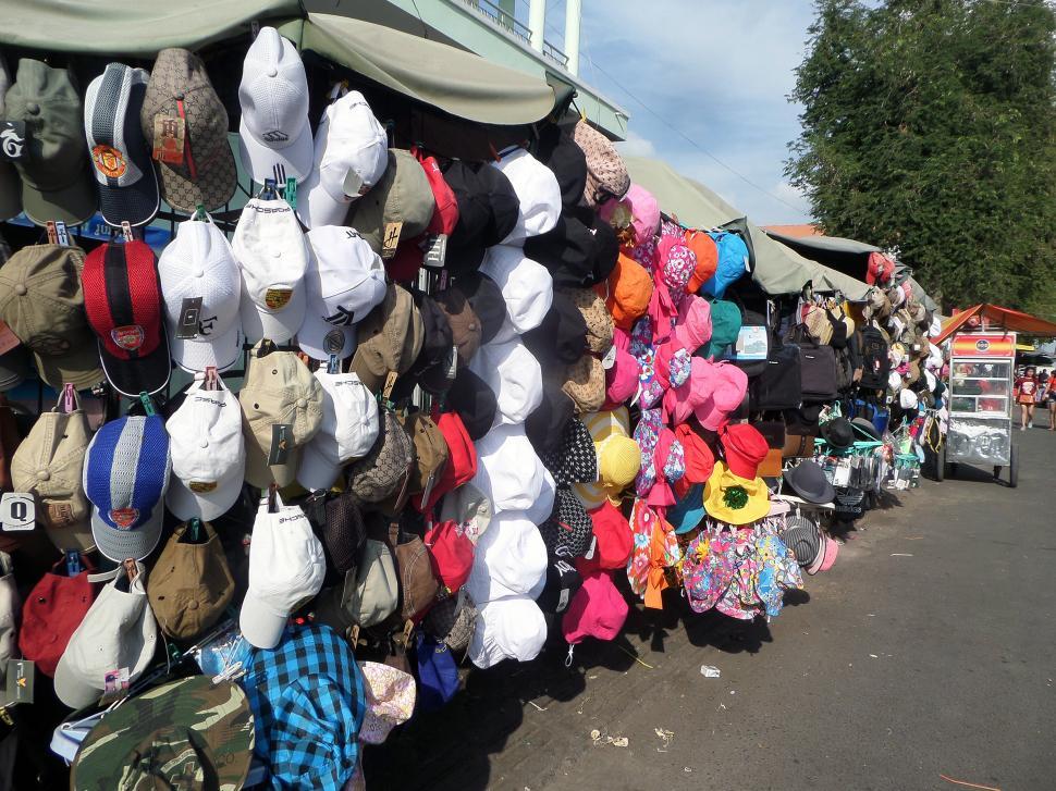 Free Stock Photo of Hats on display at street clothing market ...