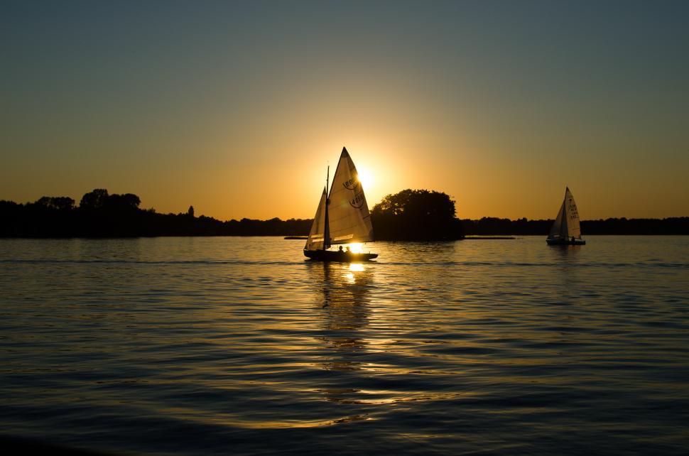 Free Stock Photo of Sun Setting Over Body of Water | Download Free ...