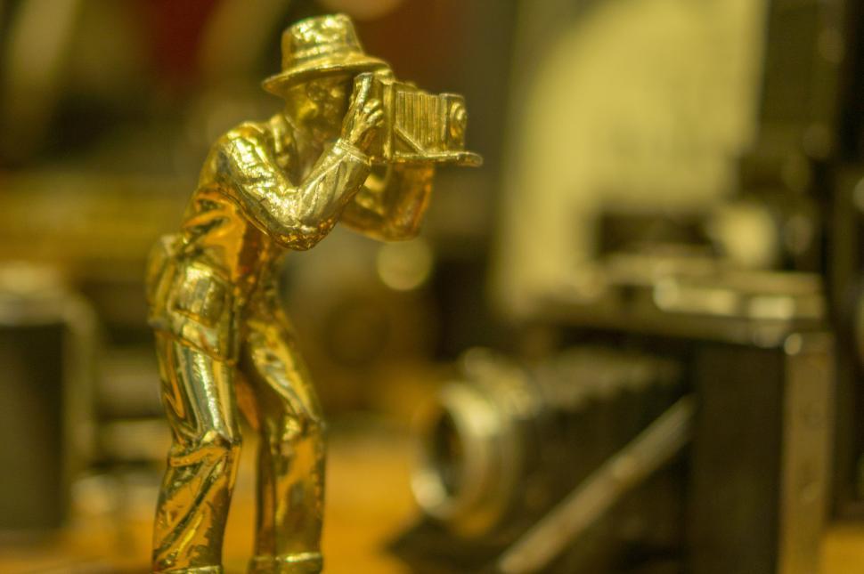 Free Stock Photo of Gold Statue of a Man Holding a Gun | Download Free ...