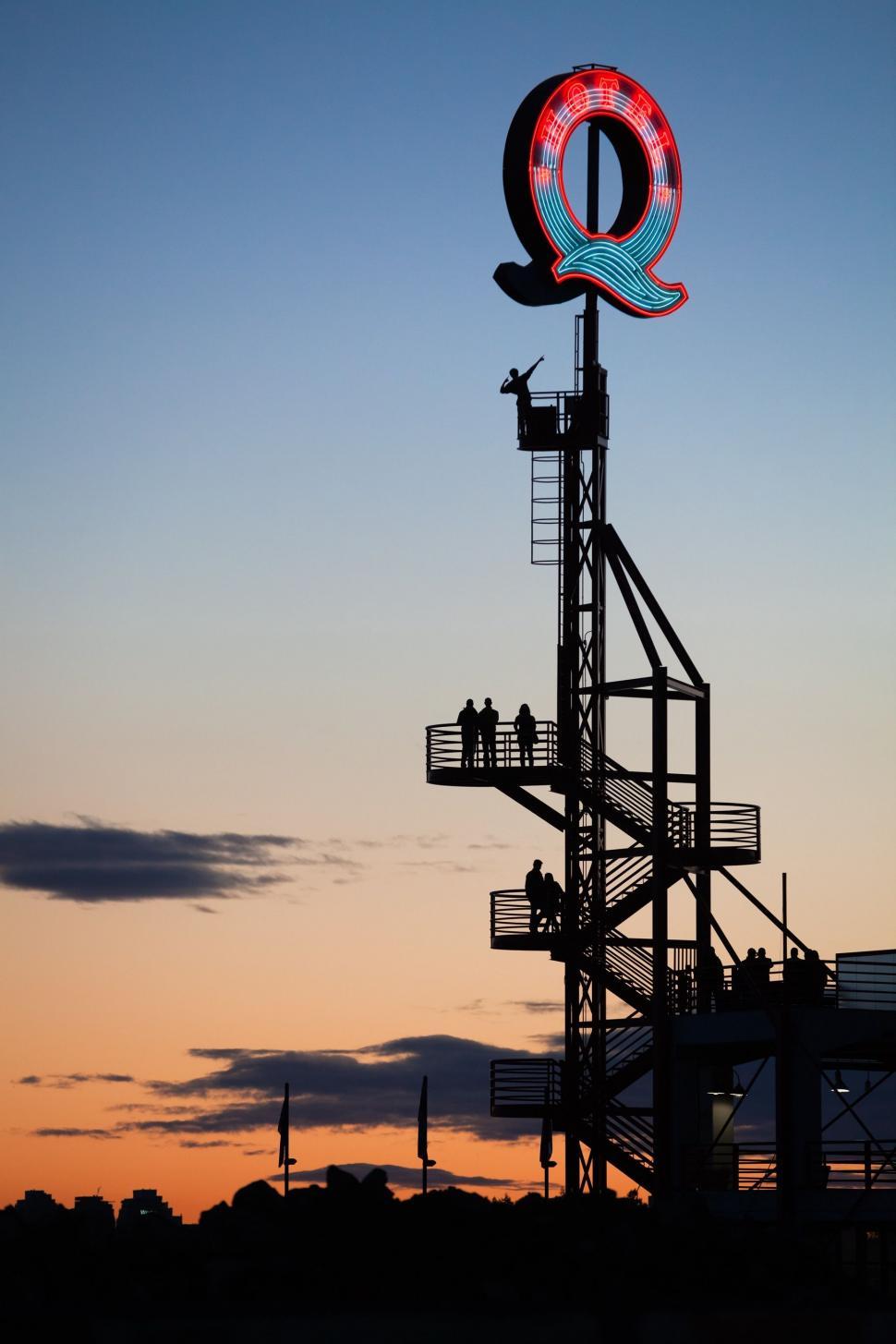 Free Stock Photo of Large Sign on Top of Tall Tower | Download Free ...