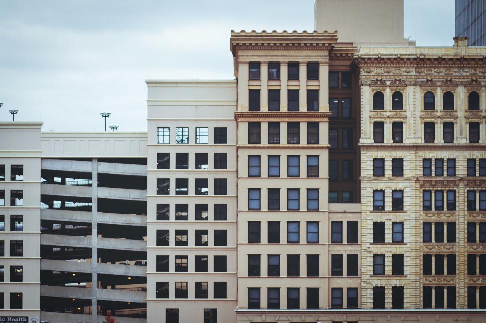 Free Stock Photo of Tall Building With Lots of Windows Surrounded by ...