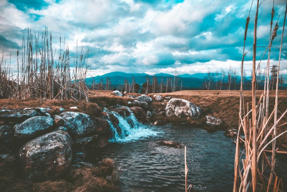 Free Stock Photo of Stream Flowing Through Dry Grass Covered Field ...