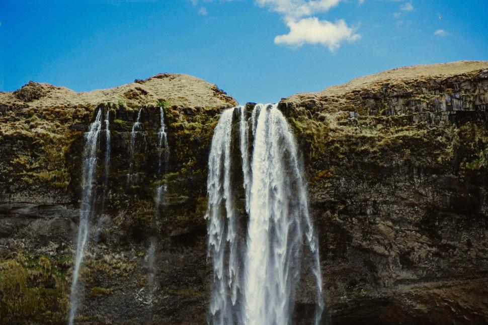 Free Stock Photo of Man Riding Surfboard in Front of Waterfall ...