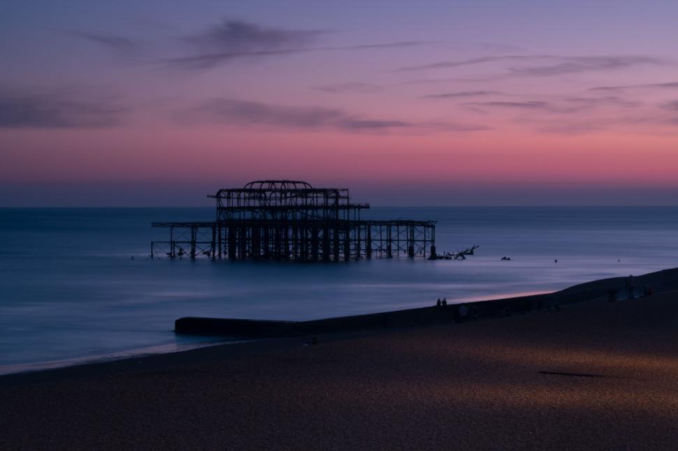 Free Stock Photo of Large Structure Overlooking Beach by the Ocean ...
