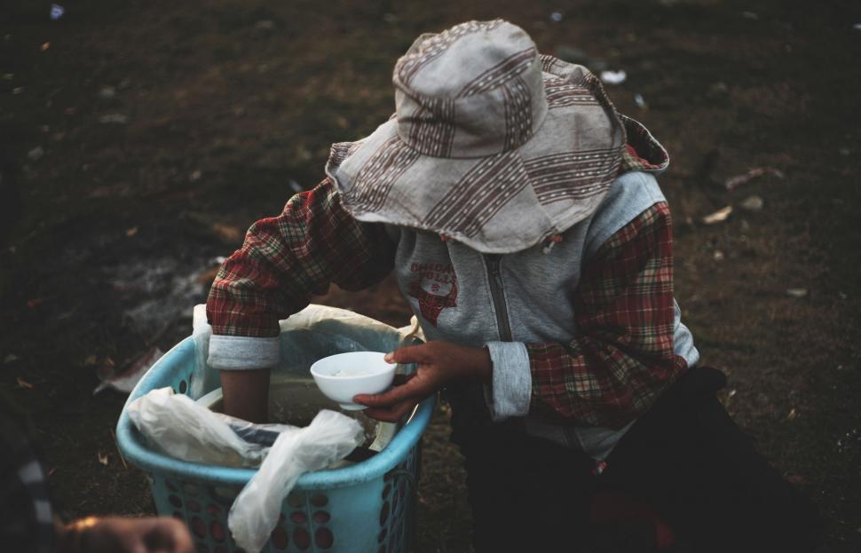 Free Stock Photo of Person Sitting in Bucket With Object | Download ...