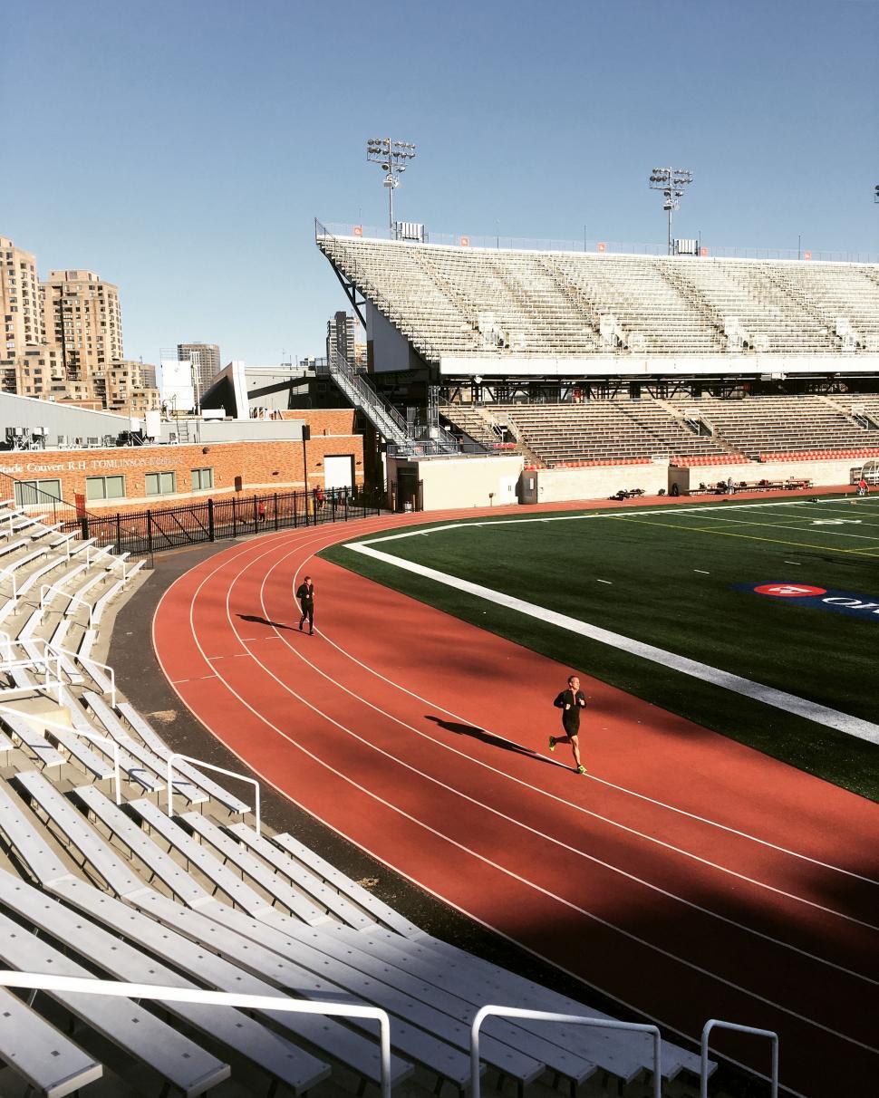 Free Stock Photo of Man Running on Track in Stadium | Download Free ...