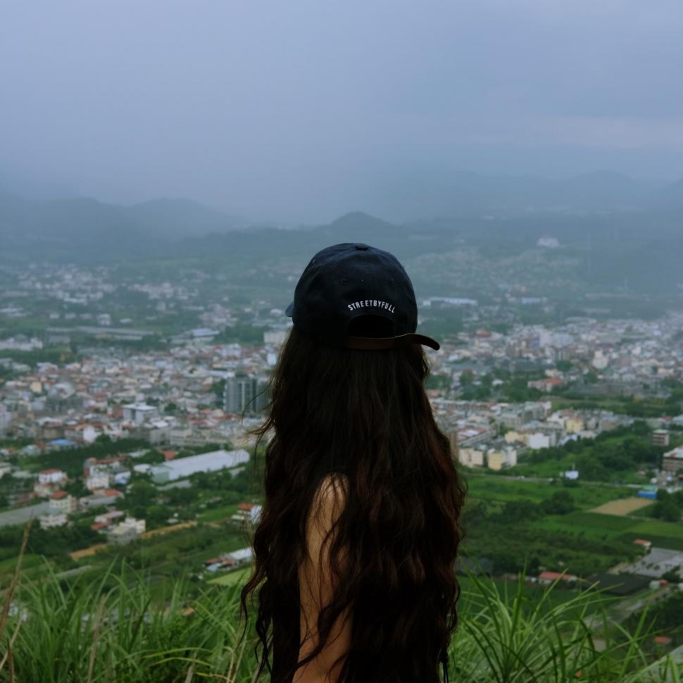 Free Stock Photo of Woman With Long Hair Wearing Hat Looking Out Over ...