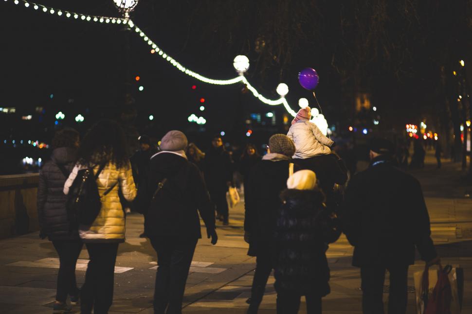 Free Stock Photo of Group of People Walking Down a Street at Night ...