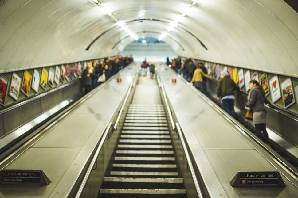 Free Stock Photo of Group of People Riding Down an Escalator | Download ...