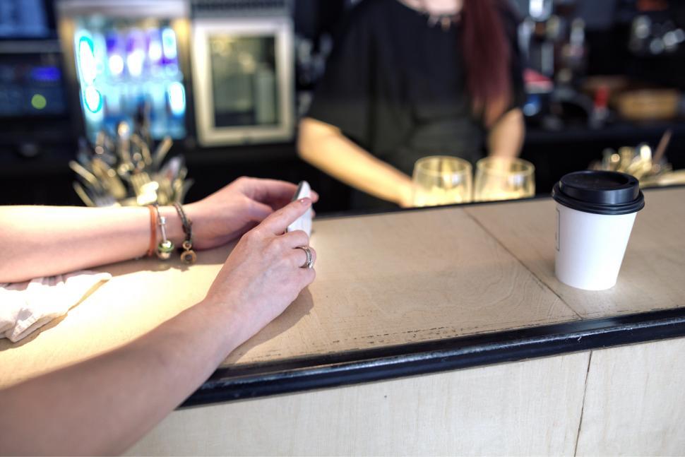 Free Stock Photo of Woman Sitting at Counter With Cup of Coffee ...