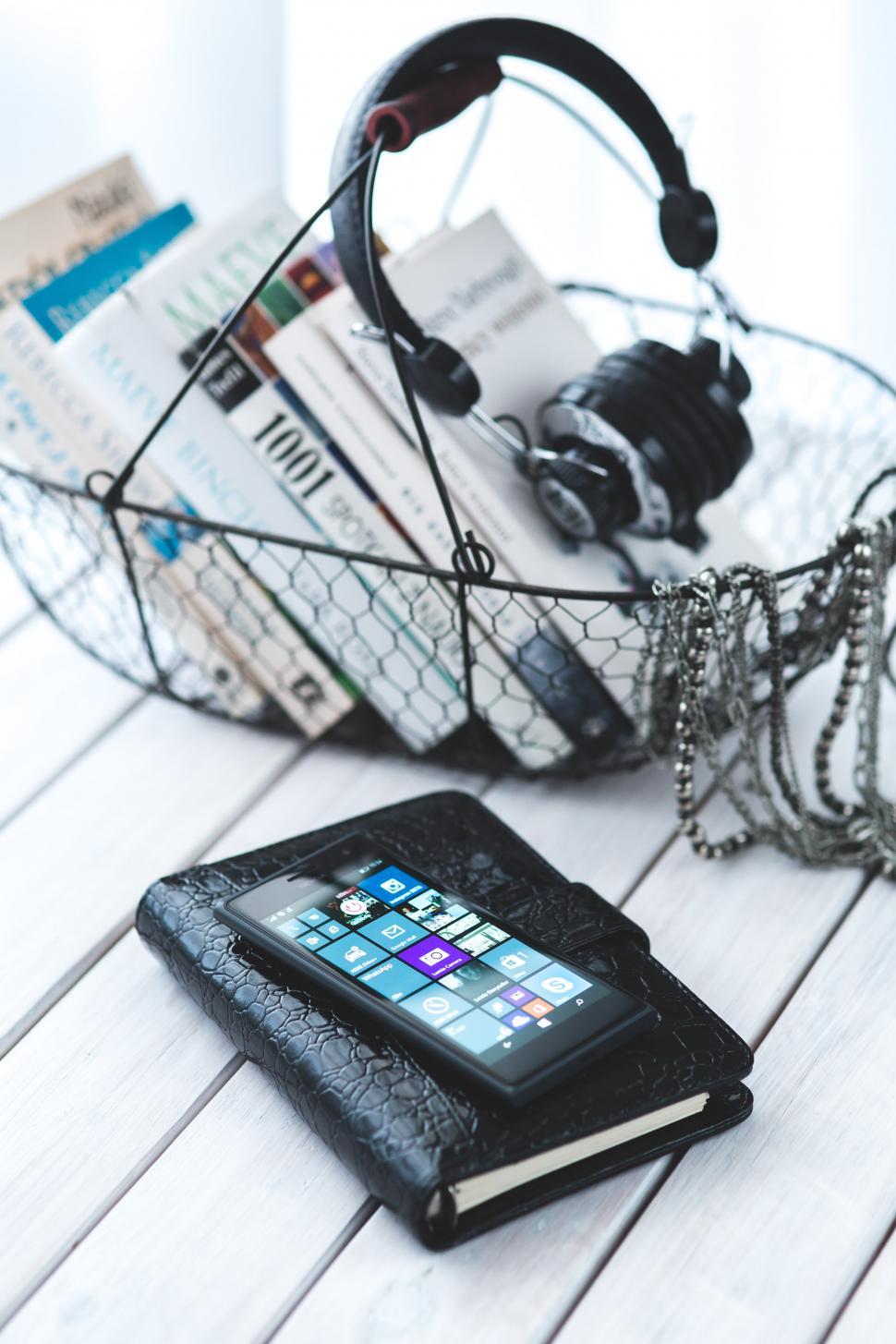 Free Stock Photo of Cell Phone Next to Basket of Books | Download Free ...