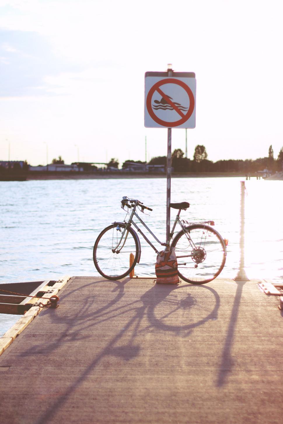 Free Stock Photo of Bicycle Parked on Dock Next to Sign | Download Free ...