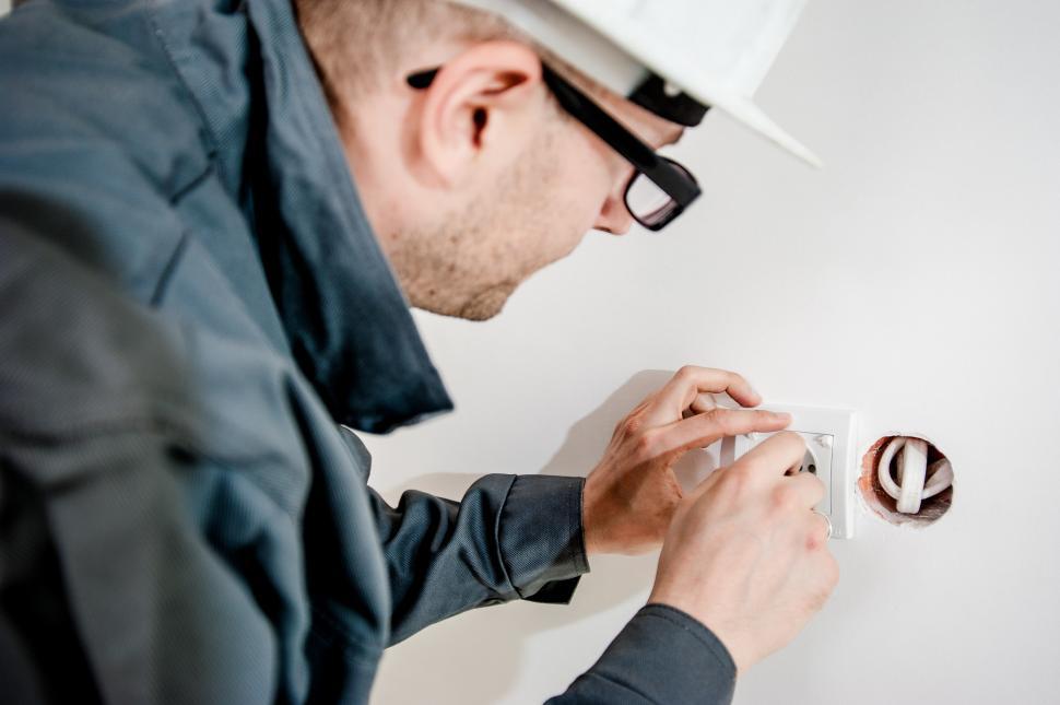 Free Stock Photo of Man in Hard Hat Fixing Light Switch | Download Free ...