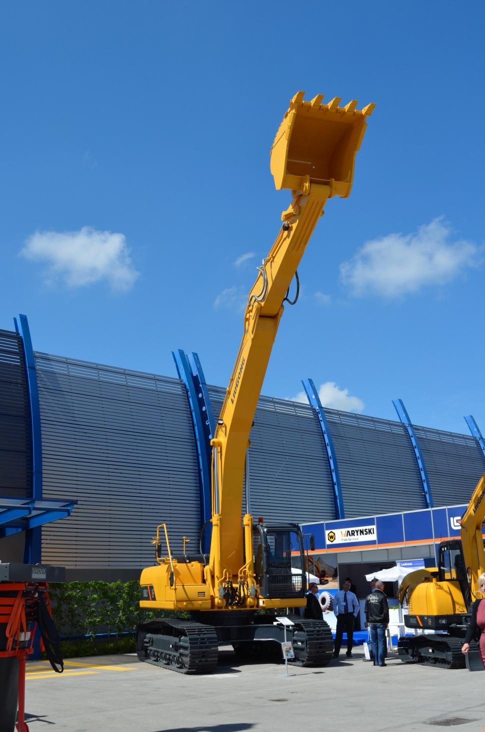 Free Stock Photo of Man Standing Next to Yellow Crane | Download Free ...