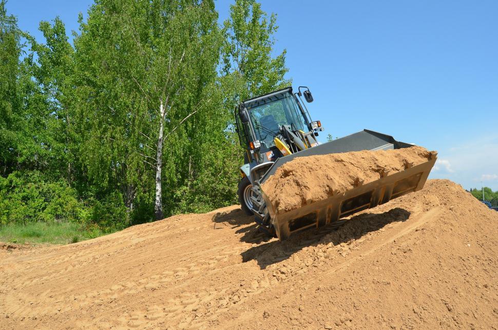 Free Stock Photo of Bulldozer Digging Through Dirt in Field | Download ...