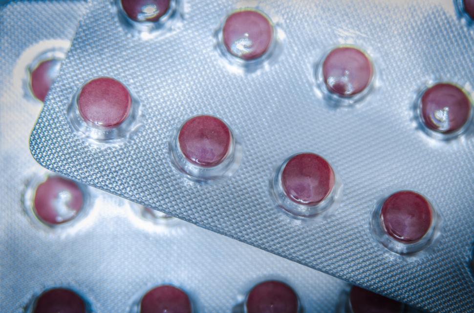 Free Stock Photo of Close Up of Contraption Filled With Red Pills ...
