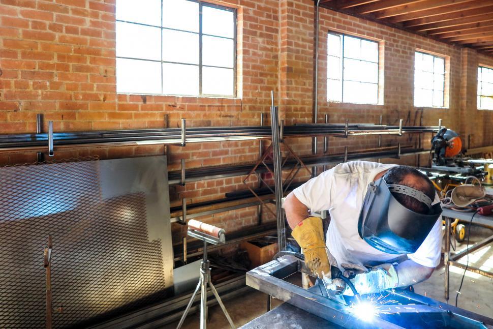 Free Stock Photo of Welder working in an industrial warehouse ...