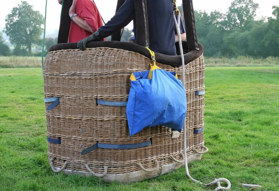 Free Stock Photo of Man and Woman Standing Inside Large Basket ...