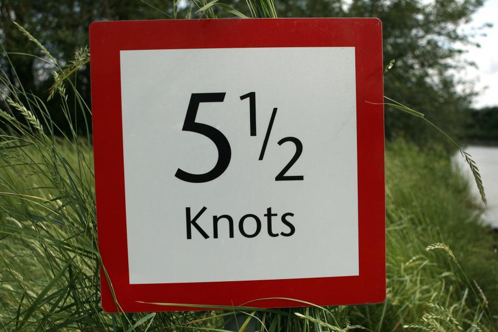 Free Stock Photo of Red and White Sign Displaying 5 / 2 Knots ...