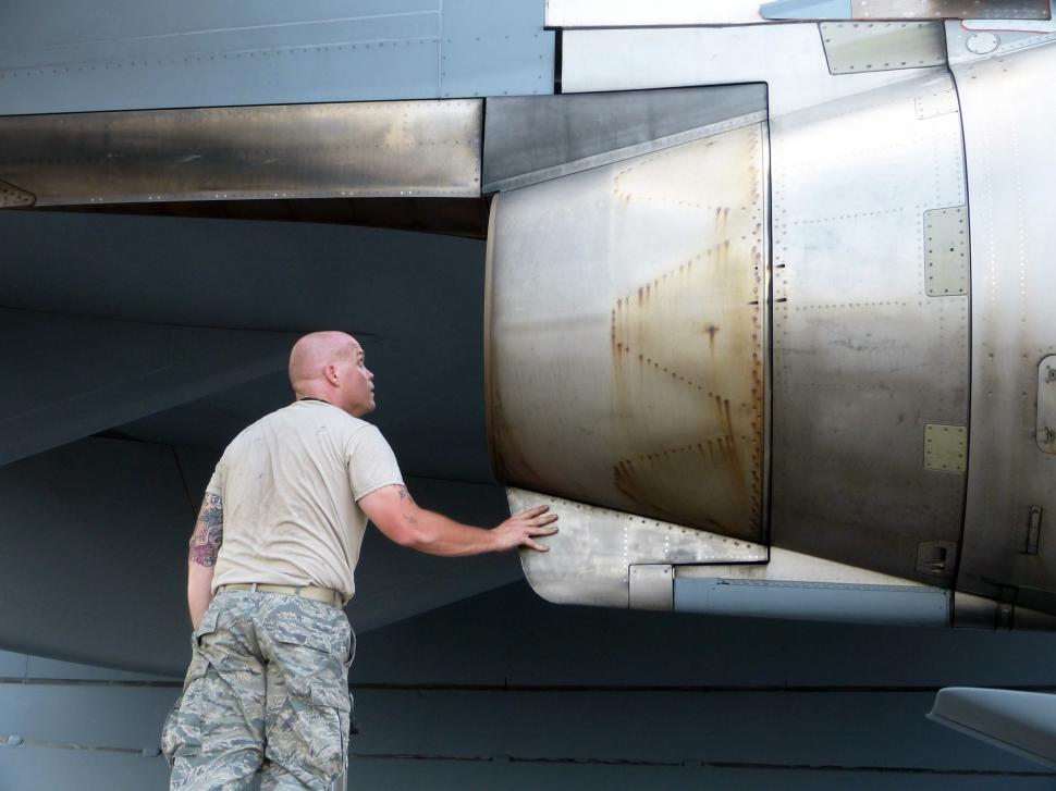 Free Stock Photo of Man Standing Next to Large Jet Engine | Download ...