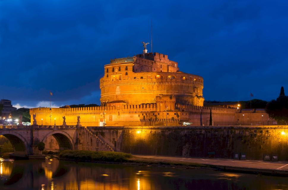 Free Stock Photo of Castle Illuminated at Night Beside River | Download ...
