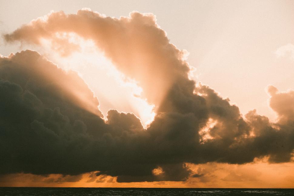 Free Stock Photo of A Plane Flying Through a Cloudy Sky Over the Ocean ...