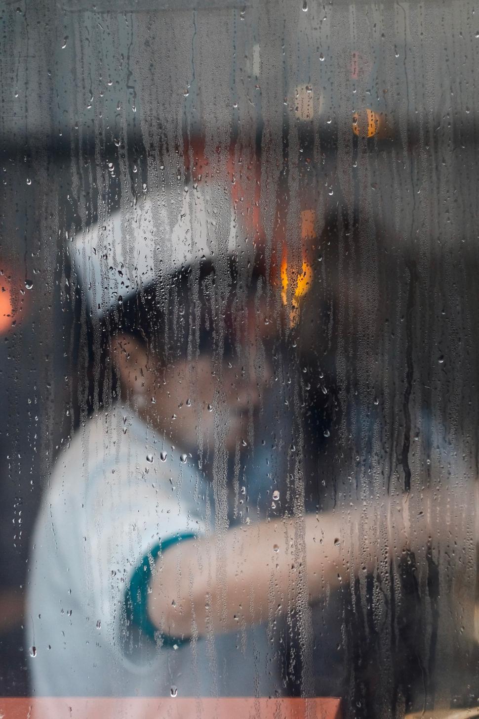 Free Stock Photo of Man Standing in Front of Rain-Covered Window ...