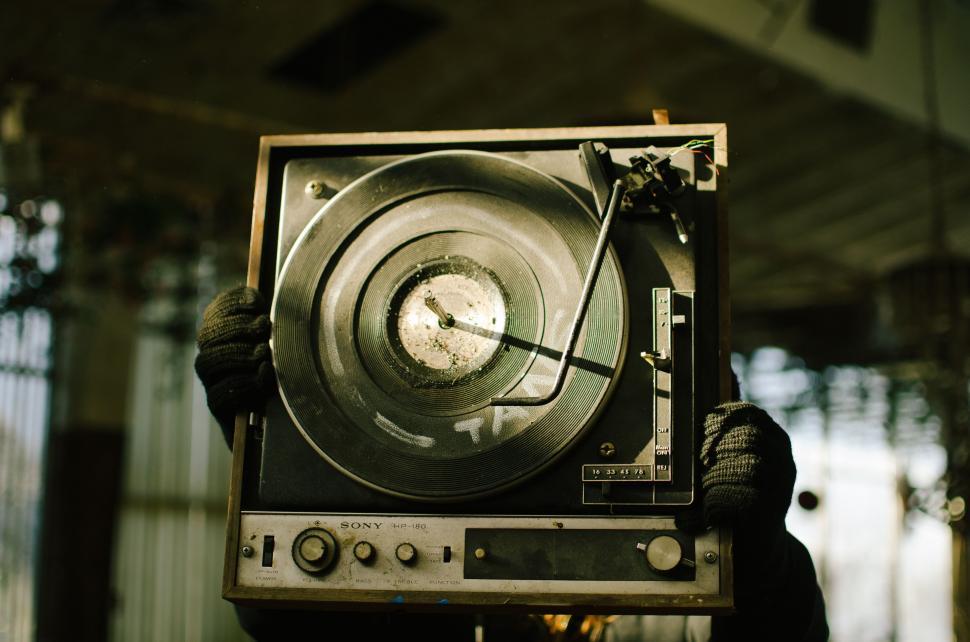 Free Stock Photo of Person Holding Up Record Player in Front of Window ...