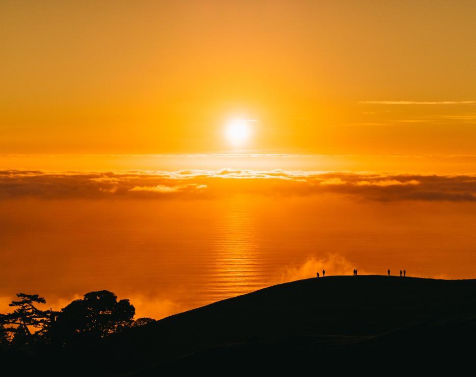 Free Stock Photo of Sun Setting Over Hill With Fog | Download Free ...