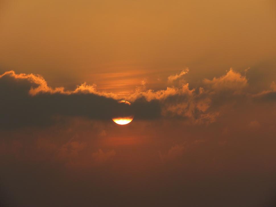 Free Stock Photo of Sun Setting Over Clouds in Sky | Download Free ...