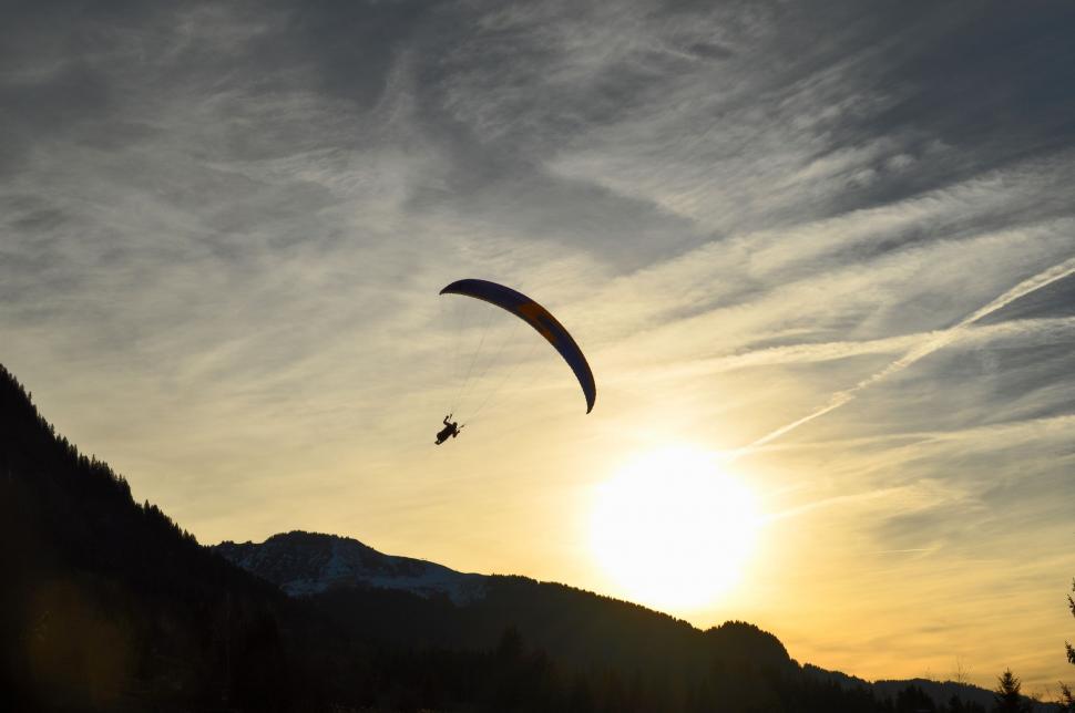 Free Stock Photo of Person Paragliding Over Mountain at Sunset | Download Free Images and Free ...