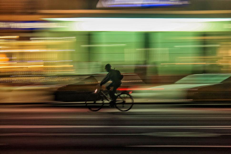 Free Stock Photo of Man Riding a Bike Down a Street | Download Free ...