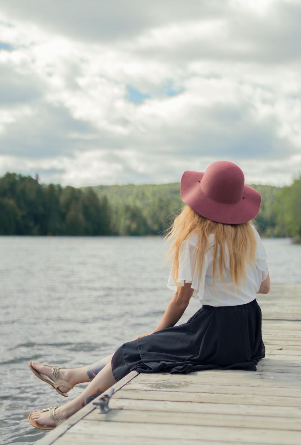 Free Stock Photo of Woman Sitting on Dock With Hat | Download Free ...