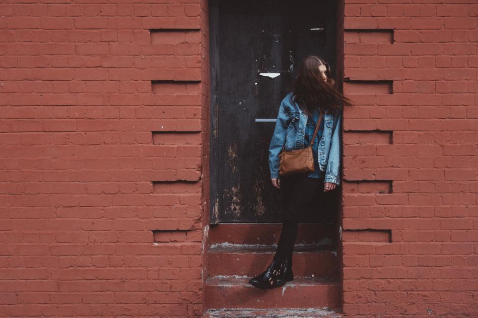 Free Stock Photo of Woman Standing in Doorway of Brick Building ...