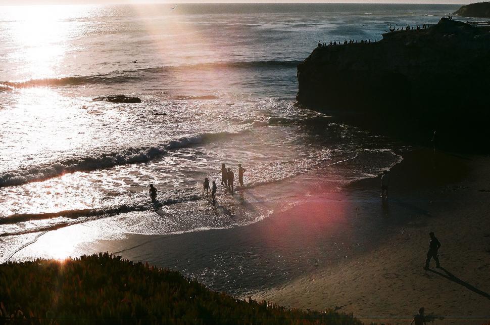Free Stock Photo of Group of People Standing on Beach by Ocean ...
