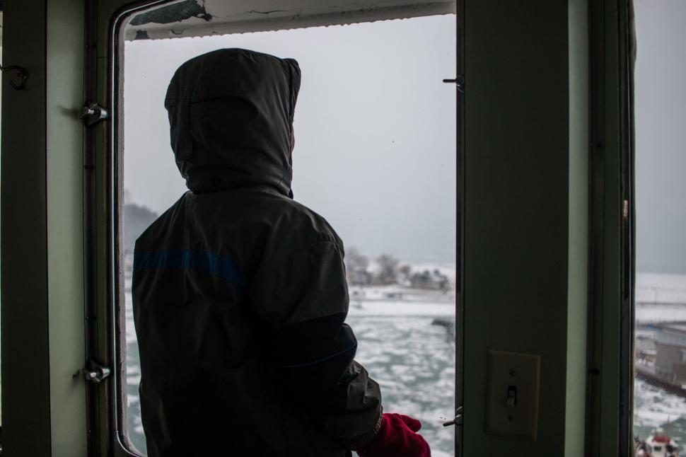Free Stock Photo of Person Standing on Boat Looking Out the Window ...
