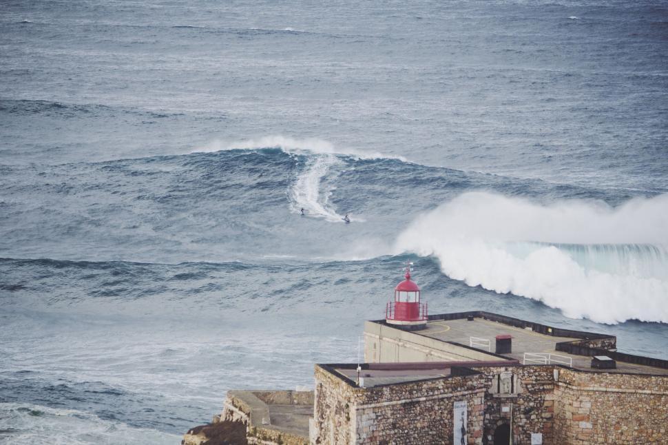 Free Stock Photo of Massive Wave Crashing Over Oceanfront Building ...