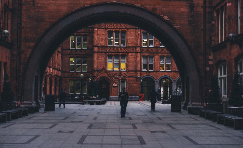 Free Stock Photo of Man Walking Through Archway in Brick Building ...